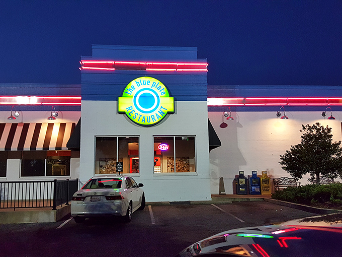 The Blue Plate's vibrant exterior stands out like a beacon of culinary hope. That bright blue and white building promises Southern comfort before you even step inside.