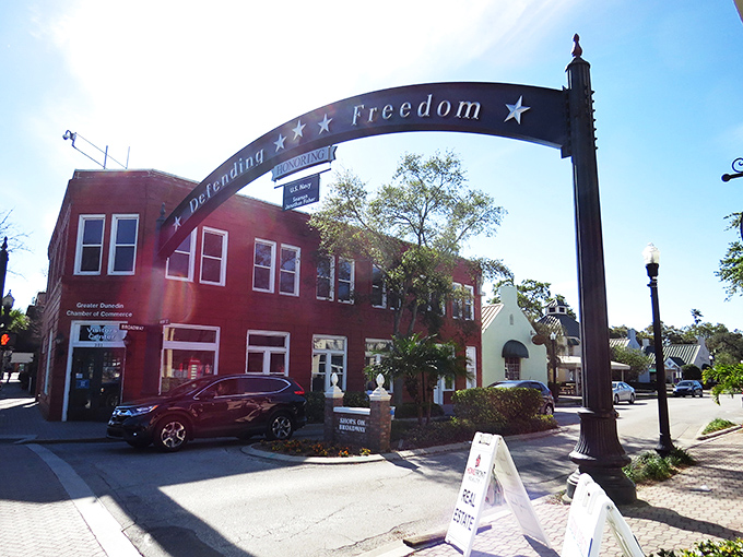 Dunedin's Main Street comes alive at twilight, where the iconic "Defending Freedom" arch welcomes visitors to a downtown that feels refreshingly un-Florida-like in all the best ways.