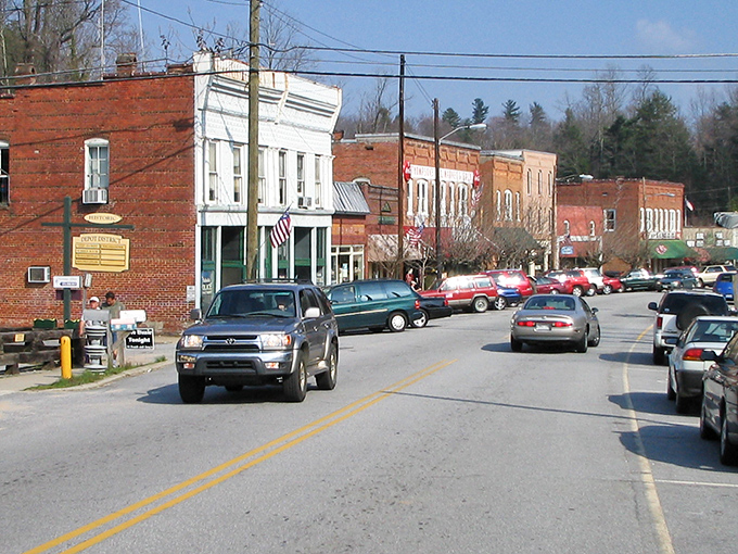Main Street Saluda welcomes you with historic brick buildings, a vintage military cannon, and that small-town charm that makes you want to cancel your return flight.