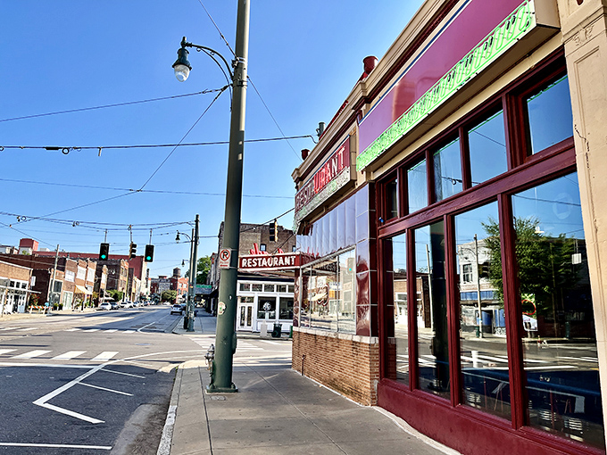 That iconic red exterior isn't just a building&mdash;it's a time machine disguised as Memphis's oldest caf&eacute;. The neon practically winks at you.