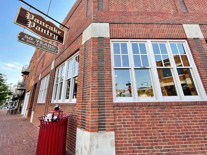 The iconic brick exterior of Pancake Pantry proudly displays its "50 Years & Still 23 Varieties" sign, a testament to perfecting rather than changing a good thing.