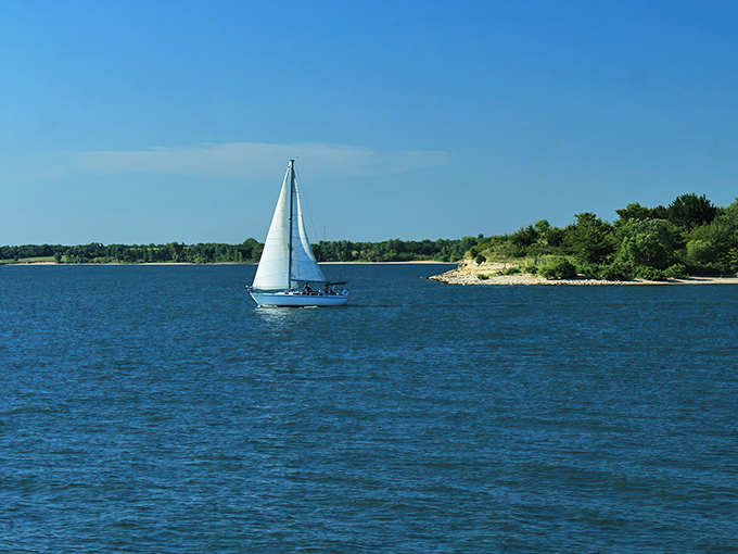 Tranquility has an address, and it's right here where water meets sky. A lone angler finds solitude while someone savors the view from shore.
