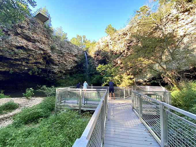 The spectacular 77-foot waterfall plunges through limestone cliffs at Natural Falls, creating an enchanting scene that feels more Pacific Northwest than Oklahoma.