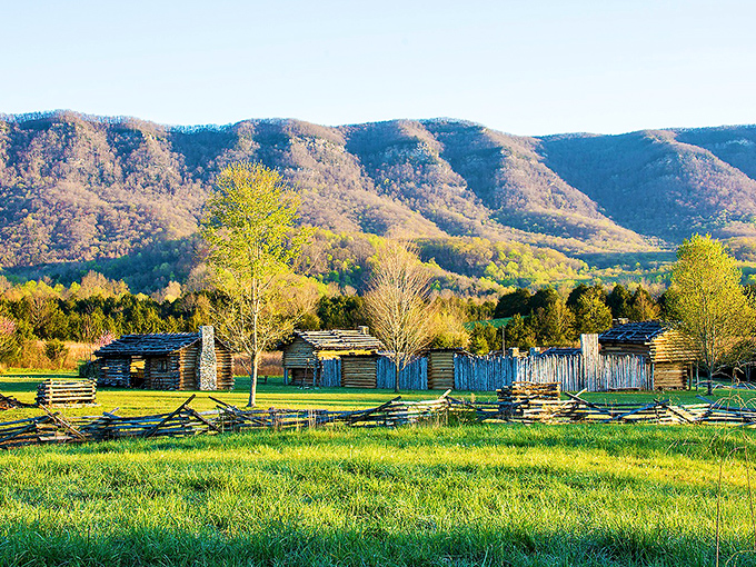 Log cabins at Martin's Station stand as silent witnesses to frontier life, with mountains providing a backdrop that hasn't changed in centuries.