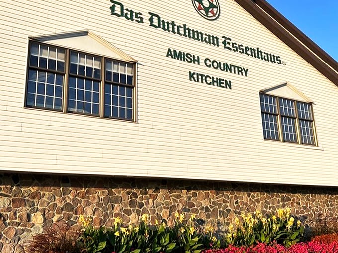 The iconic white facade of Das Dutchman Essenhaus stands proudly against the Indiana sky, promising comfort food that'll make your cardiologist wince and your soul sing.