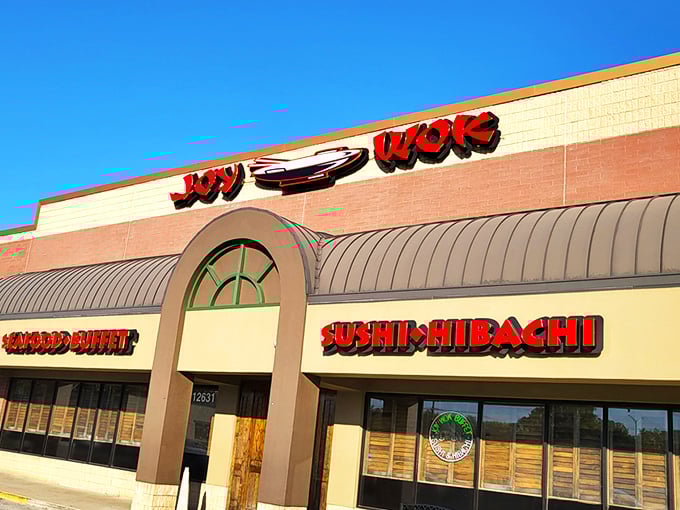 The bright red signage of JOY WOK beckons like a culinary lighthouse, promising a harbor of flavors that'll make your taste buds throw a parade.
