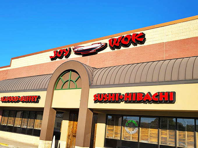 The bright red signage of JOY WOK beckons like a culinary lighthouse, promising a harbor of flavors that'll make your taste buds throw a parade.