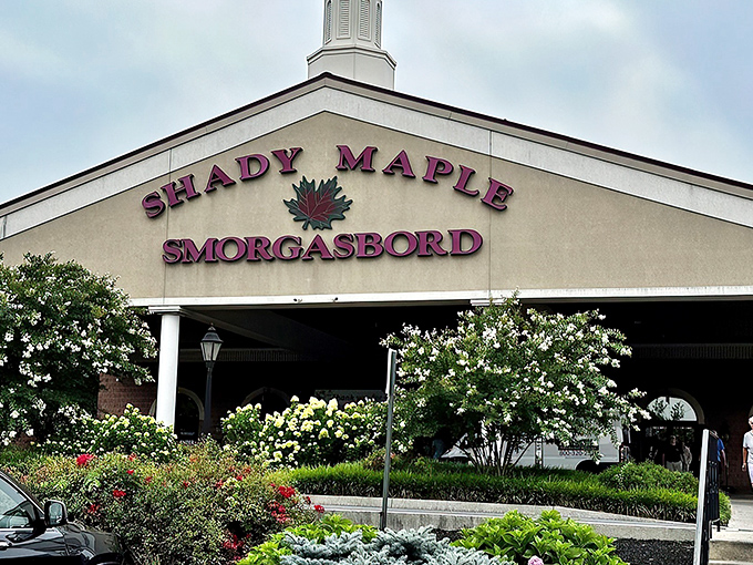 The majestic entrance to Shady Maple Smorgasbord stands proudly against the Pennsylvania sky, promising culinary adventures that would make even the most disciplined dieter surrender willingly.