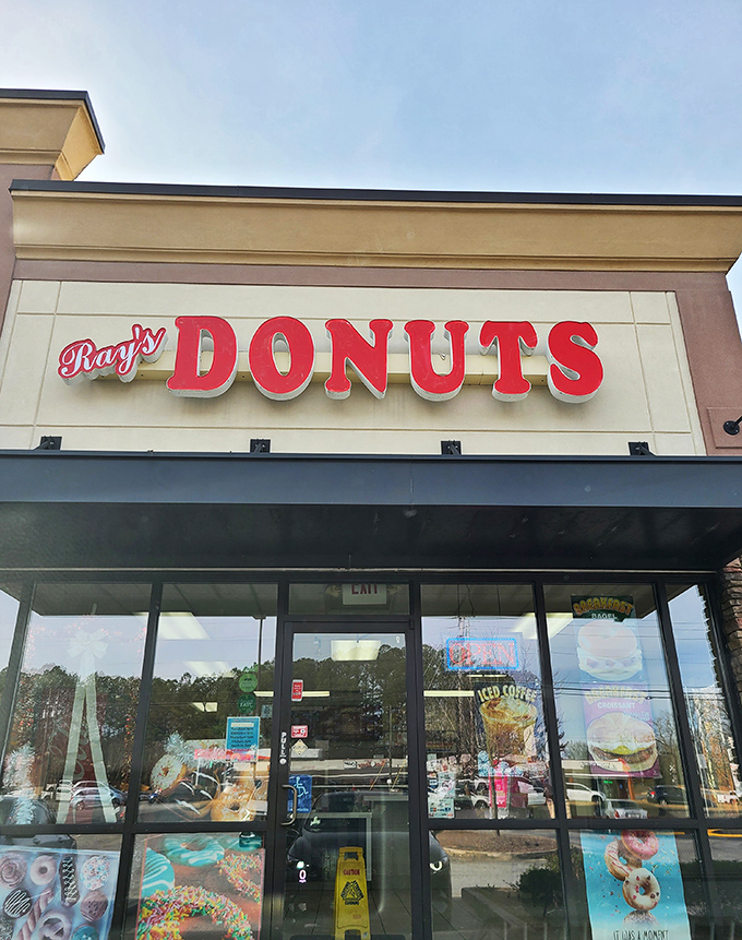 Ray's Donuts announces itself with understated confidence, its stone facade and orange lettering promising sweet treasures within like a suburban Willy Wonka factory.