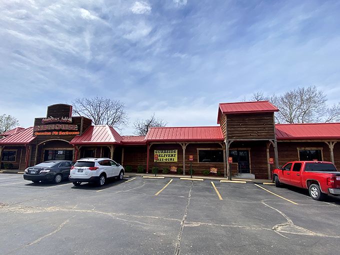 The rustic wooden facade of Smokin' Joe's Ribhouse isn't trying to impress anyone&mdash;until you taste what's cooking inside. That red roof? Consider it a beacon for barbecue pilgrims.