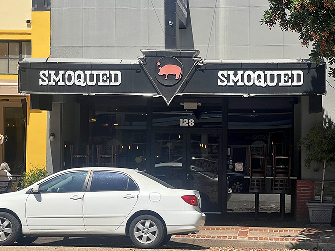 The pink pig silhouette perched atop Smoqued's sign isn't just cute &ndash; it's a beacon of hope for BBQ lovers wandering the California desert of mediocre meat.
