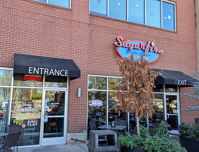 The brick-and-mortar temple of smoke beckons with its cheerful blue sign and red neon "BARBECUE" promise&mdash;a siren call to hungry travelers.