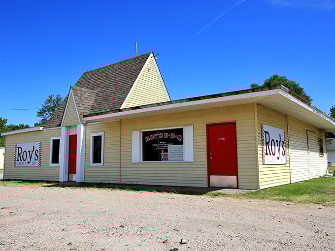 The unassuming yellow building with its bright red door stands like a beacon of barbecue hope on Hutchinson's West 4th Avenue.