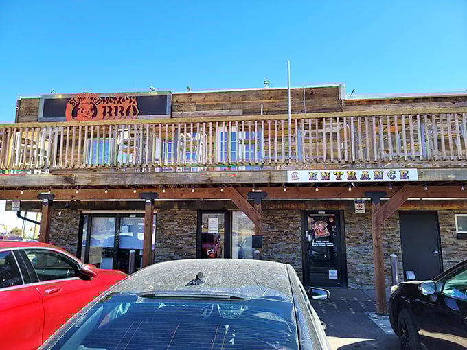 The rustic wooden exterior of Seasoned Swine BBQ beckons like a siren song to meat lovers. That deck practically begs you to enjoy your brisket with a side of Colorado sunshine.