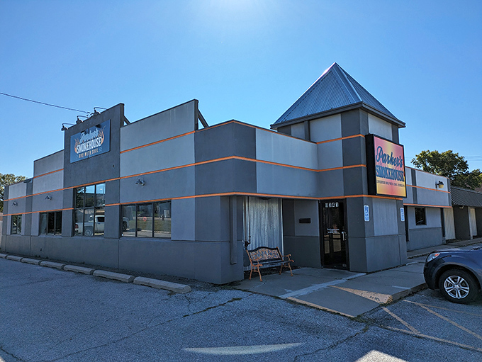 The blue neon sign proclaiming "BBQ WITH SOUL" isn't just marketing&mdash;it's a mission statement that Parker's Smokehouse delivers on with every smoky bite. 