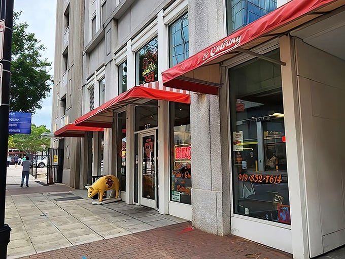 The neon glow of Clyde Cooper's storefront is like a lighthouse for hungry barbecue pilgrims, beckoning from downtown Raleigh since 1938.