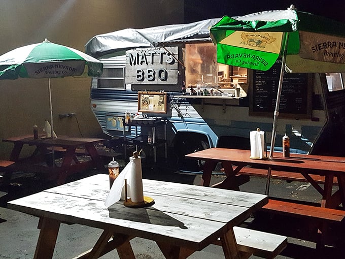 The covered dining area at Matt's BBQ offers the perfect blend of Portland's outdoor vibe and Texas-style communal eating. Picnic tables await hungry patrons.