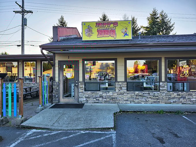 The bright yellow sign of Jeff's Texas Style BBQ beckons hungry travelers like a smoky lighthouse guiding ships through fog. 