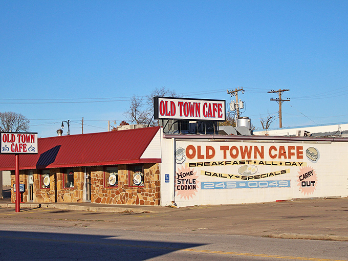 The unassuming exterior of Old Town Cafe stands as a beacon for breakfast lovers, promising "BREAKFAST ALL DAY" like a mantra for the hungry masses.