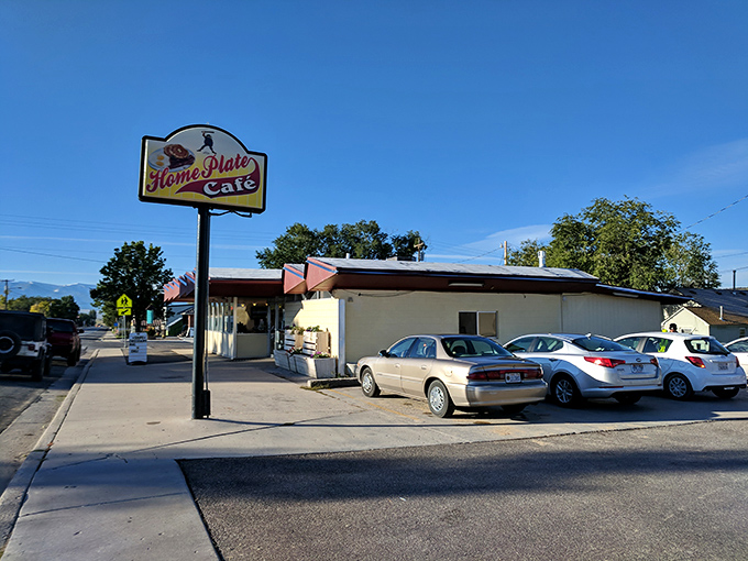 The classic red-trimmed exterior with vintage sign says everything you need to know—unpretentious, welcoming, and ready to feed you properly.
