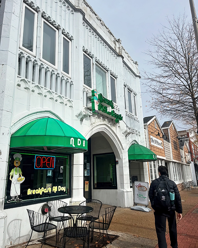The distinctive white facade with emerald green awnings of Newark Deli & Bagels stands out like a culinary beacon on Main Street.