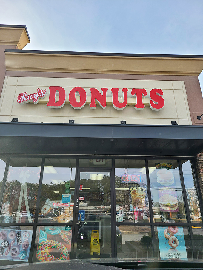 The siren call of that "Donuts" sign hits different at 7am &ndash; Ray's storefront promises morning salvation in strip mall form.