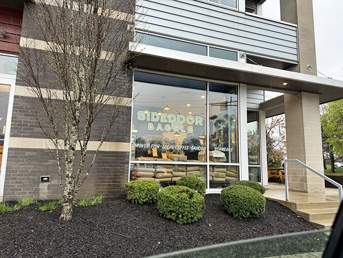 The unassuming exterior of Sidedoor Bagel belies the culinary treasures within. Those flour bags in the window? That's a promise, not decoration.
