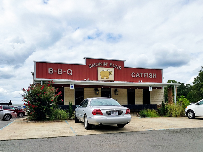 The culinary shrine beckons with its no-nonsense red facade, promising two sacred Arkansas food groups: BBQ and catfish. No fancy frills needed.
