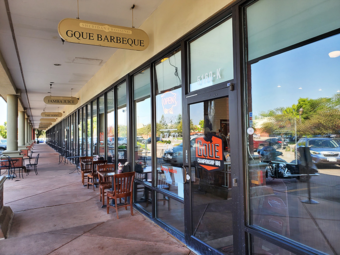 GQue's unassuming storefront hides barbecue greatness like a superhero's secret identity. The real magic happens behind those glass doors.