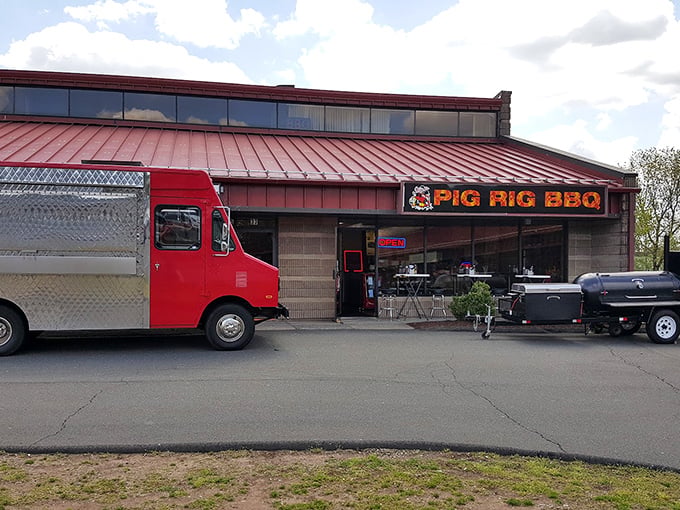 The unassuming exterior of Pig Rig BBQ in Wallingford hides a smoky paradise within. Like finding a diamond in the rough, but the diamond is brisket.