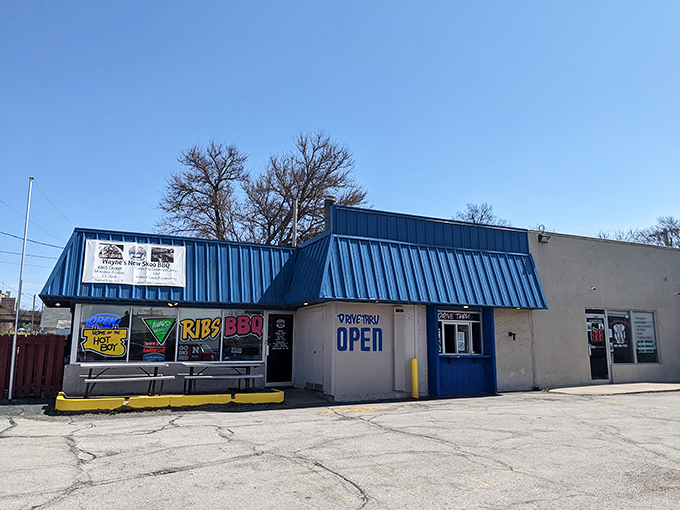 The blue exterior of Wayne's New Skoo BBQ beckons like a smoke signal to hungry travelers. This unassuming strip mall spot proves Nebraska's barbecue scene is no flyover affair.