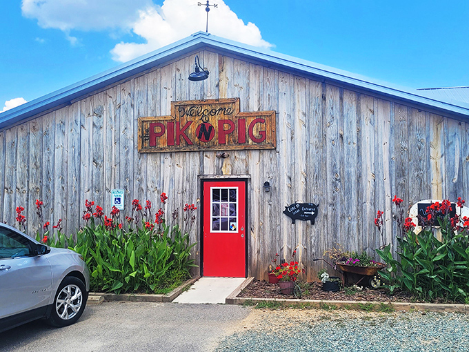 The weathered wooden exterior with its vibrant red door isn't just rustic charm&mdash;it's a barbecue beacon calling hungry pilots and road-trippers alike.