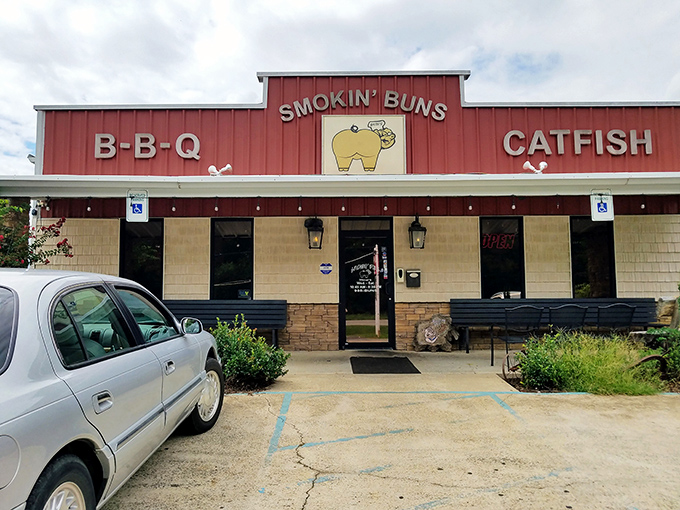 The culinary shrine beckons with its no-nonsense red facade, promising two sacred Arkansas food groups: BBQ and catfish. No fancy frills needed.