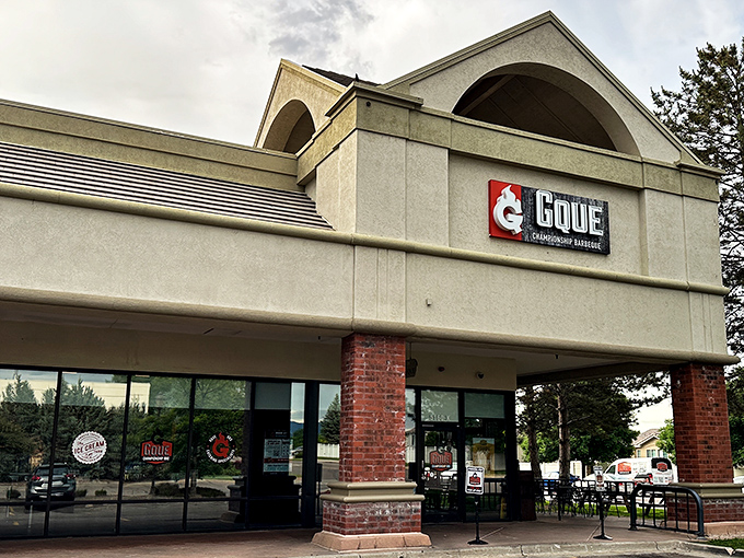 GQue's unassuming storefront hides barbecue greatness like a superhero's secret identity. The real magic happens behind those glass doors.