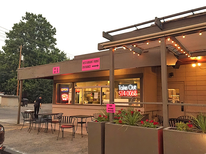 The unassuming exterior of Bodacious Pig Barbecue in Eagle hides culinary treasures within. That patio practically begs you to settle in for a smoky feast.