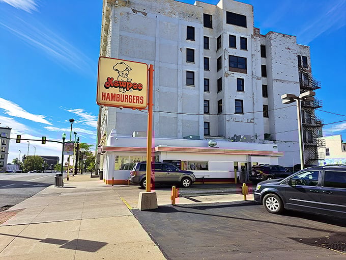 The iconic Kewpee exterior stands like a time capsule in downtown Lima, complete with its signature doll mascot keeping watch over hungry visitors.