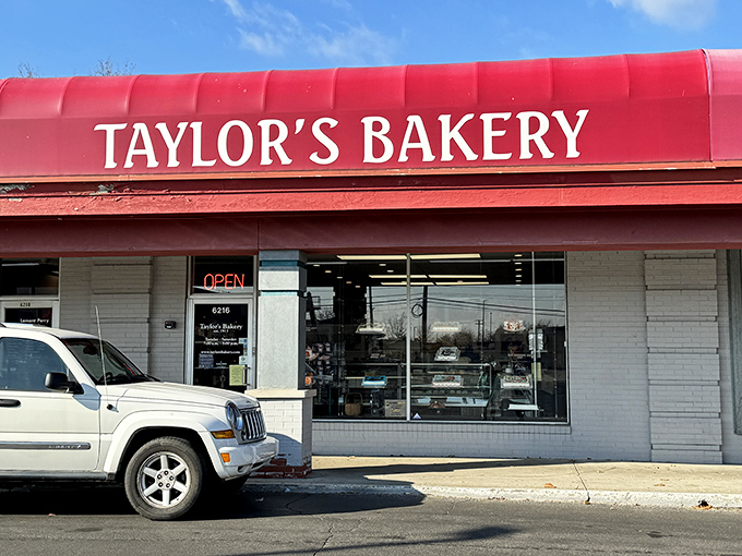 The iconic red awning of Taylor's Bakery stands as a beacon of sweetness in Indianapolis, promising delectable treasures within its unassuming exterior.