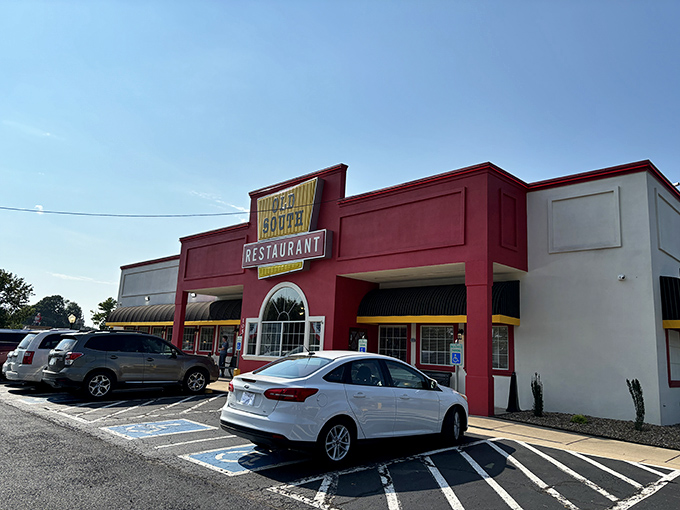 The bright red facade of Old South Restaurant stands like a beacon of comfort food salvation along the highway, promising delicious redemption for hungry travelers.