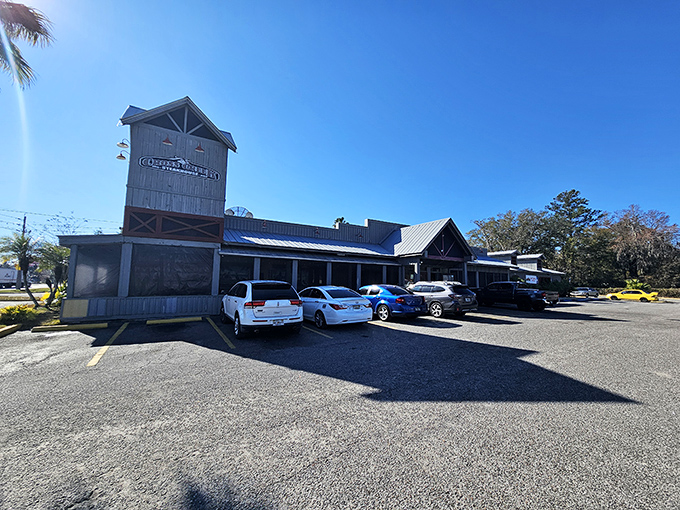 Cross Creek's neon-lit exterior transforms into a beacon of Southern comfort as dusk falls, promising culinary adventures within those wooden walls.