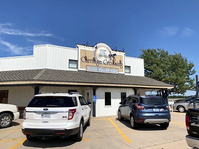 The iconic Carriage Crossing exterior stands proudly against the Kansas sky, complete with an authentic Amish buggy that isn't just for show.