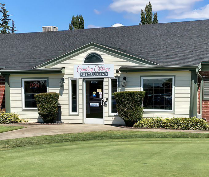The unassuming yellow exterior of Country Cottage Restaurant stands like a beacon of comfort food hope in Woodburn, promising delicious secrets within.