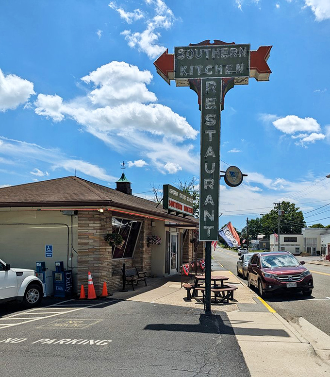 That vintage neon sign isn't just advertising &ndash; it's a time machine beckoning you to simpler days when calories didn't count and gravy was a food group.