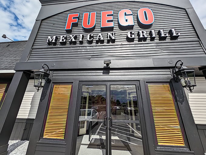 The understated exterior belies the flavor explosion waiting inside. Fuego's sleek black facade with bold red lettering makes a confident statement without the neon sombrero clich&eacute;s. 
