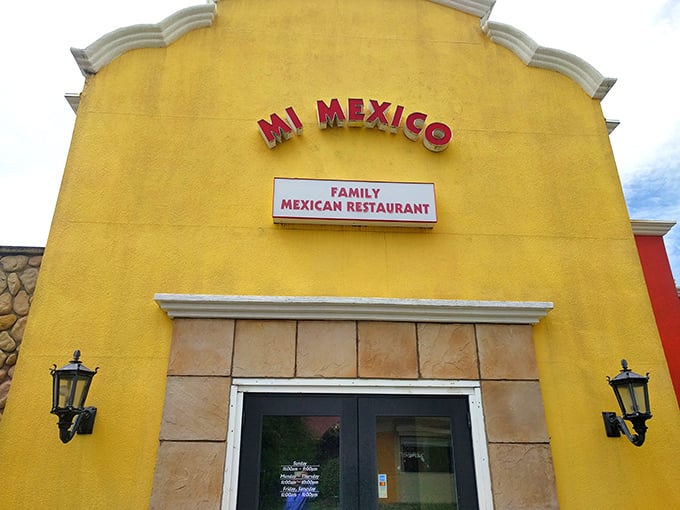 The sunshine-yellow exterior of Mi Mexico stands like a beacon of culinary promise in Clive, inviting hungry travelers to step inside and discover authentic flavors.