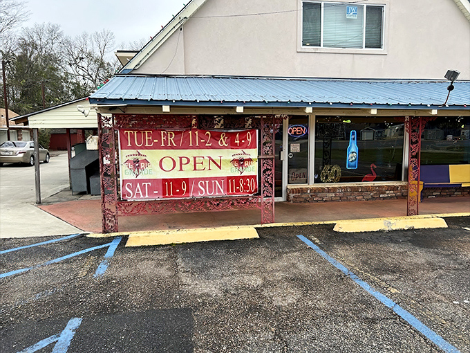 The unassuming A-frame exterior with its bright blue awning and red signage is like a secret handshake—those who know, know.