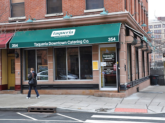 The unassuming green awning of Taqueria Downtown Catering Co. hides Jersey City's best-kept culinary secret. Like finding a diamond in your cereal box – unexpected but absolutely thrilling.