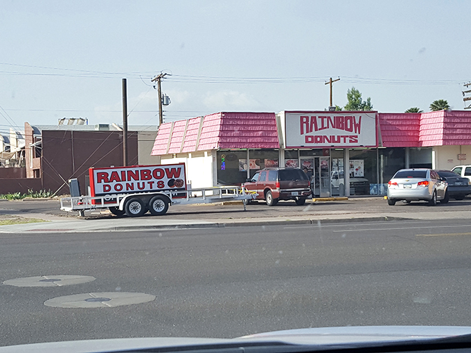 The pink-roofed sanctuary of sweetness beckons from McDowell Road, promising sugary salvation to early risers and donut devotees alike.