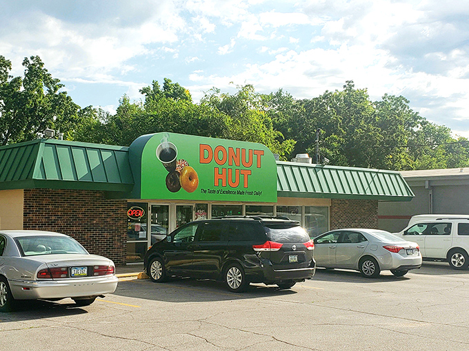 The unmistakable green awning of Donut Hut stands as a beacon of breakfast bliss in Des Moines, promising sweet salvation to early risers and sugar enthusiasts alike.