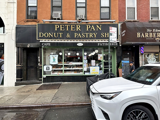 The storefront with gold lettering beckons like a sugar-coated lighthouse on Manhattan Avenue. Donut paradise awaits.