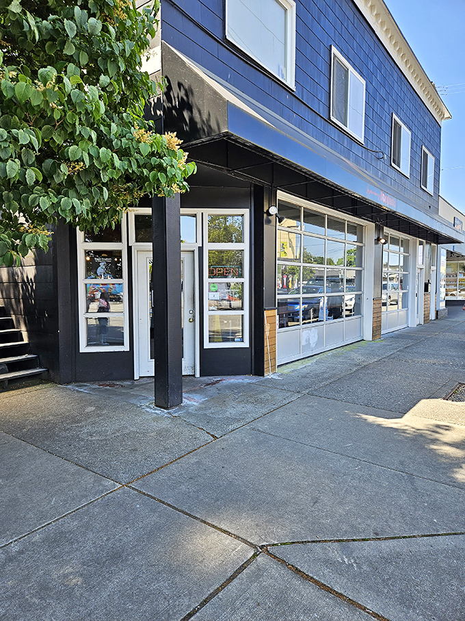 The unassuming blue exterior of Legendary Doughnuts in Tacoma hides a wonderland of fried dough treasures waiting to be discovered.